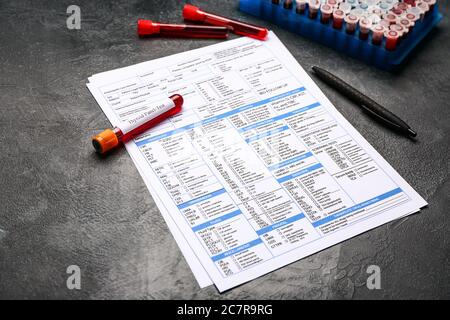 Laboratory test form and blood samples on table Stock Photo - Alamy