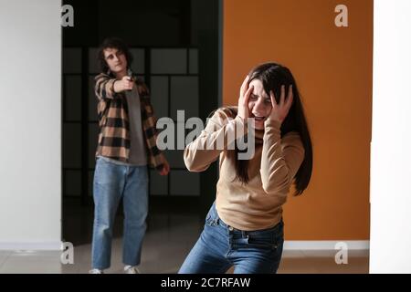 Man and woman running away fear of panic Stock Photo - Alamy