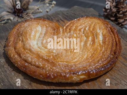 Close up butter Palmier bread, French pastry in palm leaf or a ...