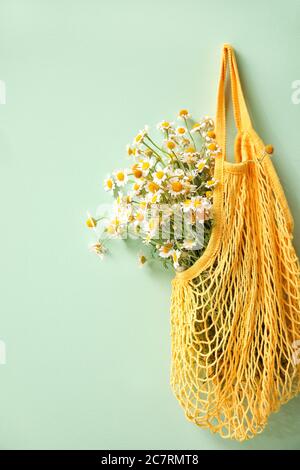 Beautiful chamomile flowers in bag indoors, closeup Stock Photo - Alamy