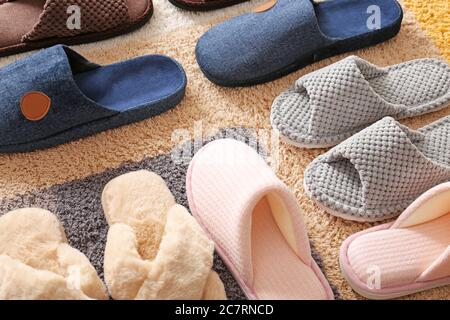 Many different soft slippers on light grey background, flat lay Stock ...