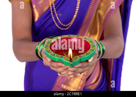 Person holding diya with hands during the Indian festivals. Karthigai ...