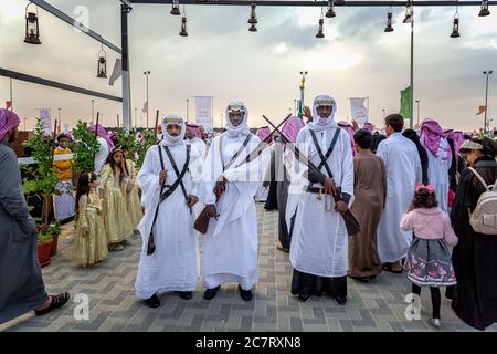 A group of Saudi Arabs performing traditional saudi arabian dance in ...