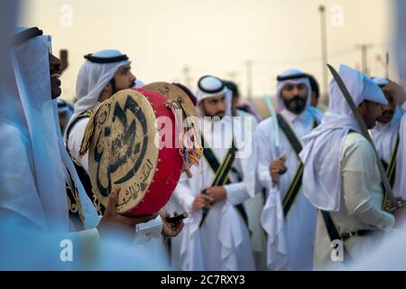 A group of Saudi Arabs performing traditional saudi arabian dance in ...