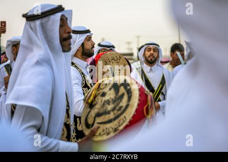 A group of Saudi Arabs performing traditional saudi arabian dance in ...