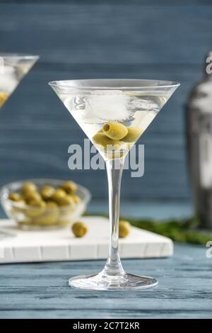 Martini cocktail with olives on grey table. Space for text Stock Photo ...