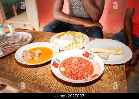 Traditional Ugandan food consisting of goat meat, cassava, potato ...