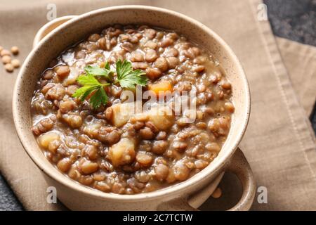 Pot of tasty lentils soup on light background, top view Stock Photo - Alamy