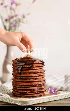 Decorating of delicious chocolate pancakes Stock Photo - Alamy