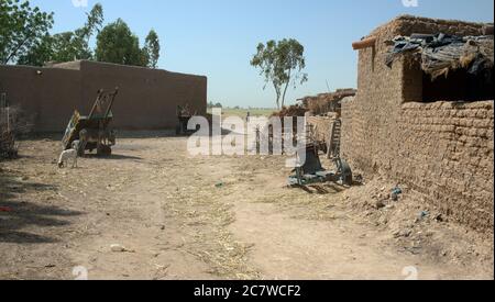 Indigenous Bozo tribe girl and boy pounding millet during harvest in ...