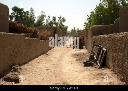 Indigenous Bozo tribe girl and boy pounding millet during harvest in ...