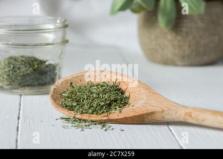 Dried Dill Weed Spilled from a Wood Spoon Stock Photo - Alamy