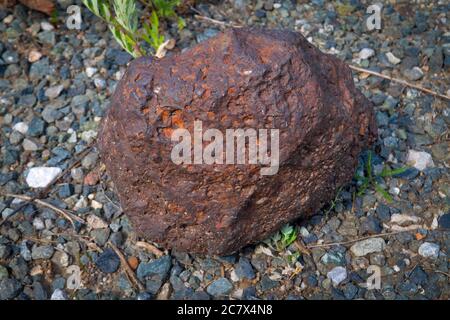 iron ore lies on the surface of the earth near the mine Stock Photo - Alamy