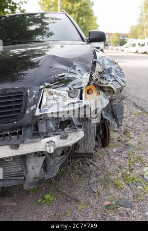 wreckage of modern car after accident used for parts out side front ...