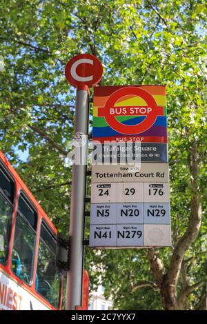 Trafalgar Square bus station stop sign with Pride rainbow decoration ...
