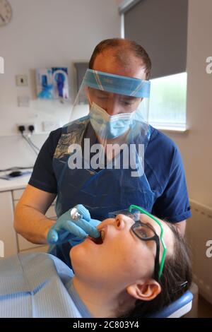 Dentist Dr Allan Clarke with fellow dentist Dr. Danielle Magee wearing ...