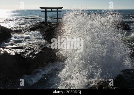 Tori Gate at the Sea with Gushing Waves Stock Photo - Alamy