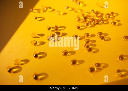 Yellow vitamin soft gelatin capsules with oily drug and nutritional ...