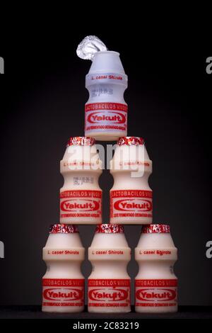 Bottles of Yakult yogurt probiotic health drink Stock Photo - Alamy