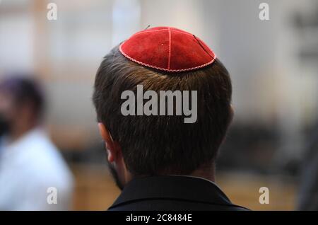 A jewish person wears a yamaka, (kippah) at a synagogue Stock Photo - Alamy