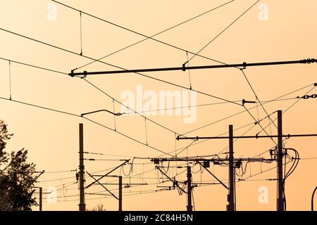 Tram overhead electrical wires in front of a building facade, Milan ...