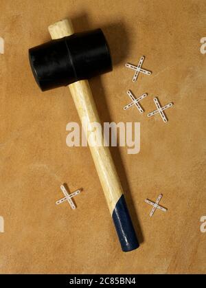 Hammer on tile Stock Photo - Alamy