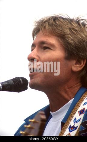 Singer John Denver performs at an Earth Day rally at the United States ...