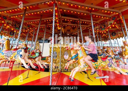 Brighton, September 7th 2006: People on the merry-go-round on Brighton ...