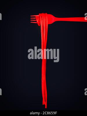 Italian spaghetti on fork on black background Stock Photo - Alamy