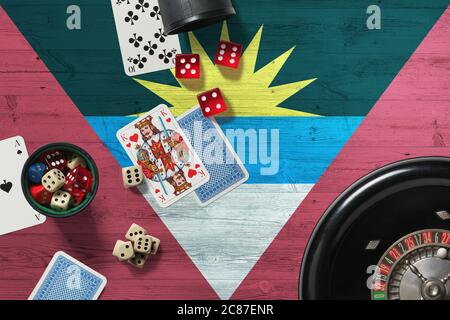 The Antigua and Barbuda flag in hand in different angles on a white ...