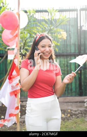 Happy asian girls take shot with Sesame Street Elmo in Universal ...