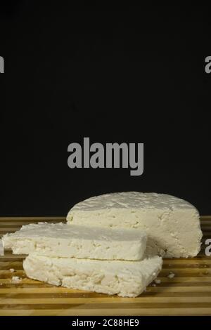 cottage cheese made from milk in the form of lumps of white color ...