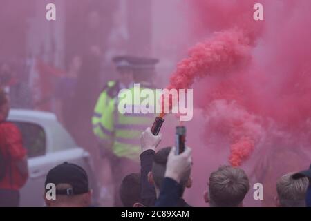 Liverpool fans set off flares outside the ground ahead of the Premier ...