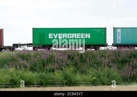 Evergreen shipping container on a freightliner train, Warwickshire, UK ...