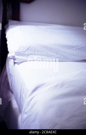 Open bed with bed sheets off. No people Stock Photo - Alamy