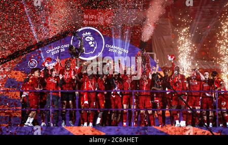 Liverpool celebrate as they lift the Premier League trophy after the ...
