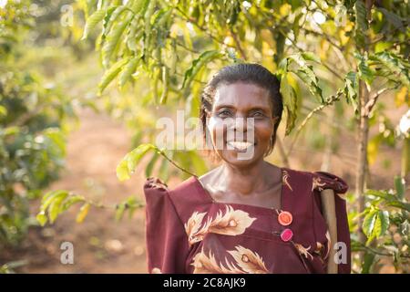 Ugandan woman wearing traditional dress and modern attire Stock Photo ...