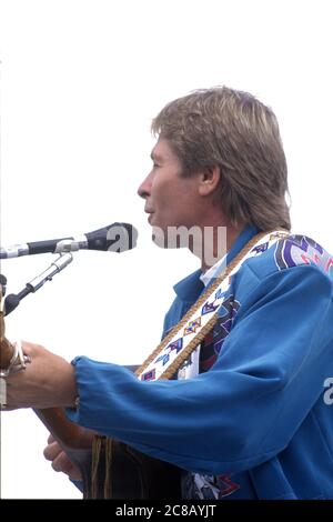 Singer John Denver performs at an Earth Day rally at the United States ...