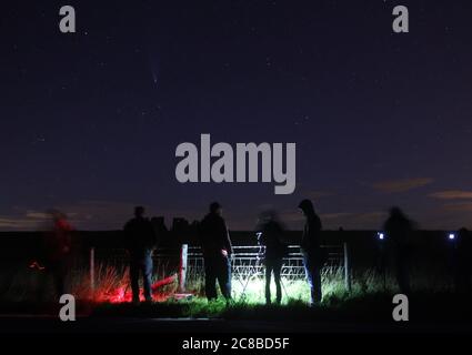 Stargazers observe Comet Neowise in the night sky over Stonehenge in ...