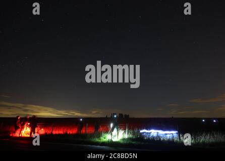 Stargazers observe Comet Neowise in the night sky over Stonehenge in ...
