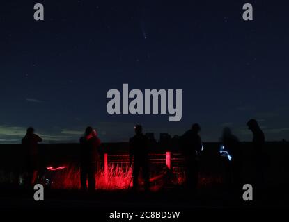Stargazers observe Comet Neowise appearing in the night sky over ...