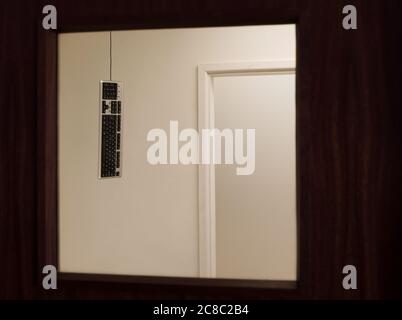 Keyboard hanging from ceiling Stock Photo - Alamy