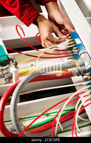 Technician fixing cabling and wiring circuit Stock Photo - Alamy