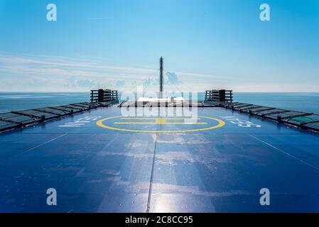 Helideck on top of a ferry at sea. Blue with yellow markings Stock ...
