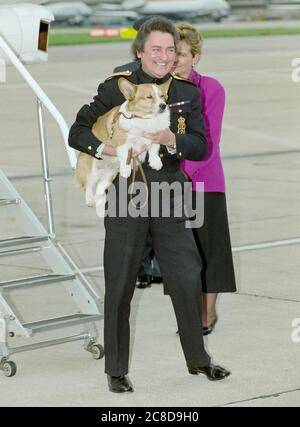 HM Queen Elizabeth The Queen Mother returning London with her pet ...