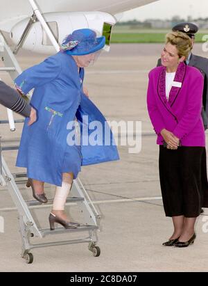 HM Queen Elizabeth The Queen Mother returning London with her pet ...