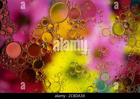 spectacular close-up of a colorful soap bubble on a black background ...