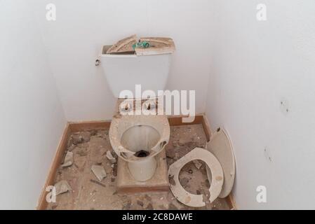 Damage worn down toilet bowl Stock Photo - Alamy