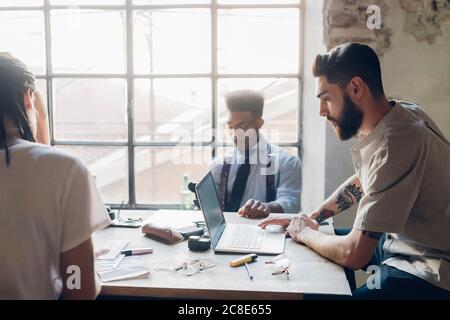 group of business people sitting at a table in the office Stock Photo ...