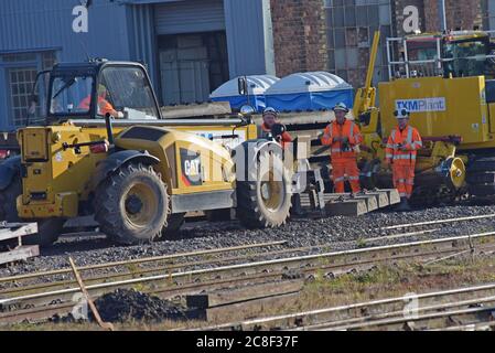 Network Rail maintenance staff working on trackside equipment on the ...